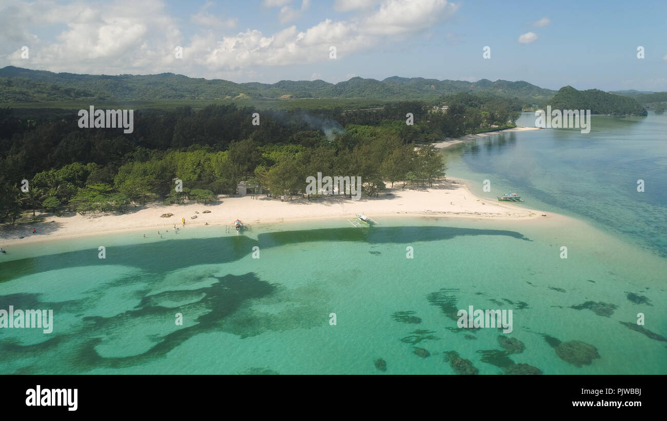 Aerial view of beautiful tropical beach with turquoise water in blue ...