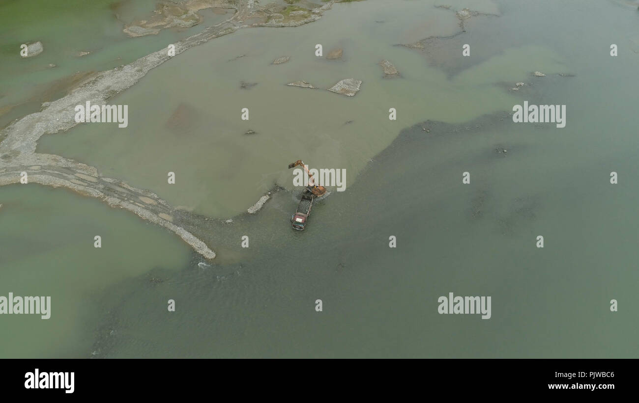 Aerial view of Excavator and heavy equipment, dredging and deepening ...