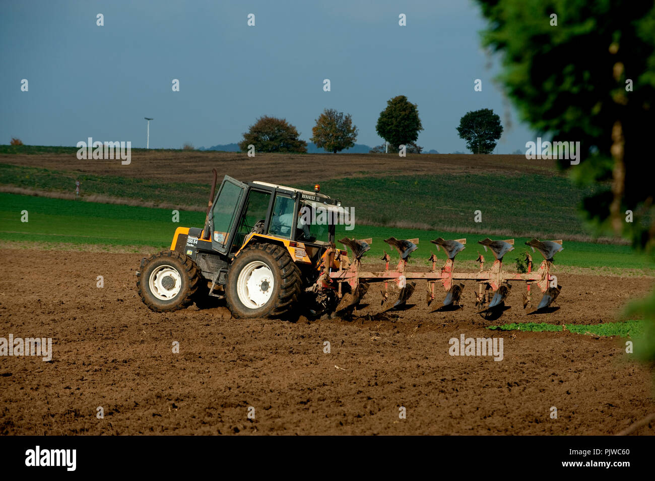 A farmer ploughing his land in Bierbeek (Belgium, 29/10/2009 Stock ...