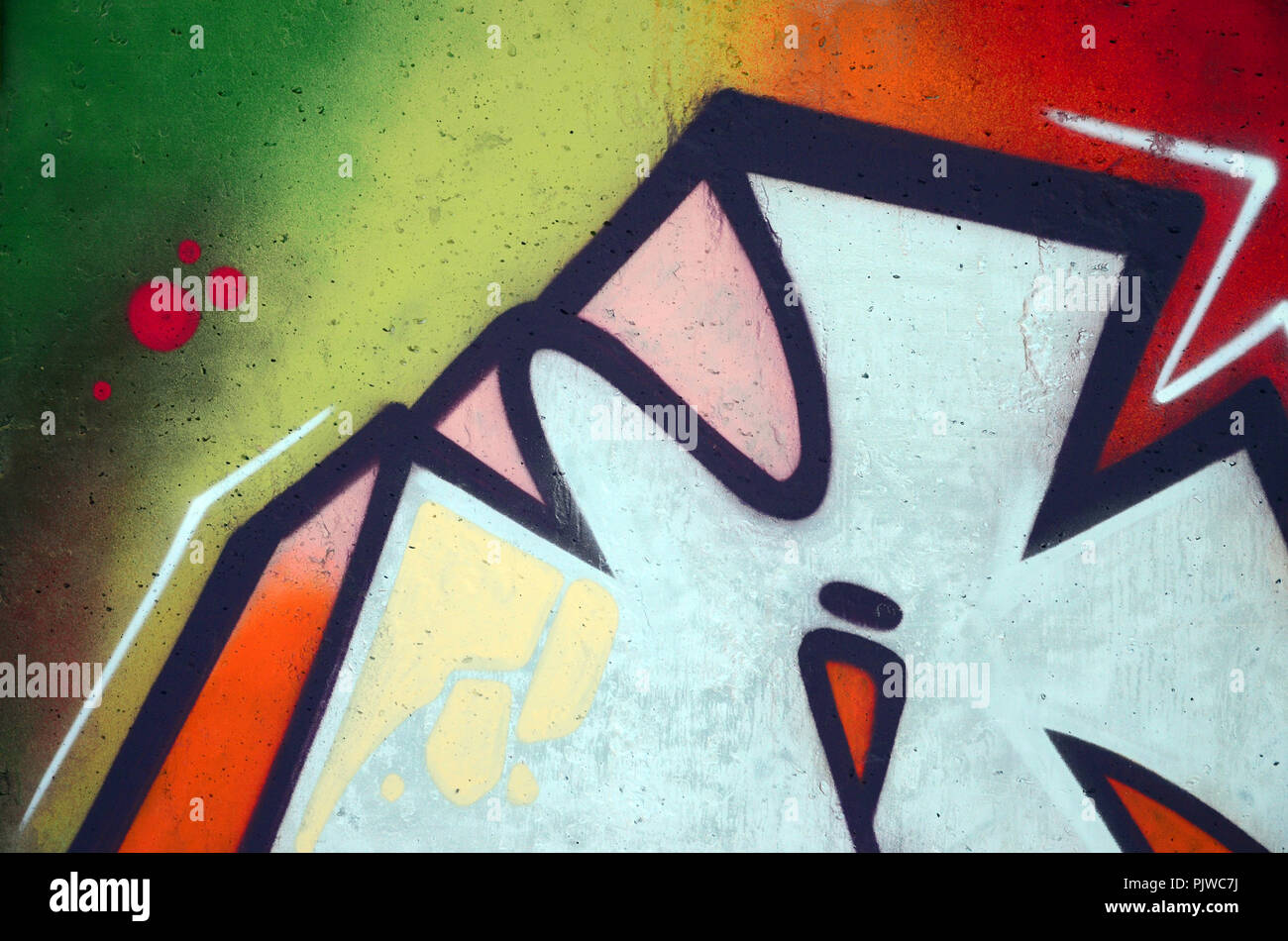 The old wall, painted in color graffiti drawing red aerosol paints ...