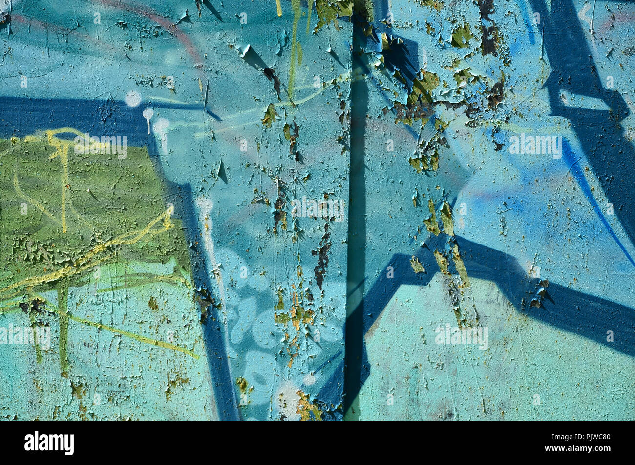 The old wall, painted in color graffiti drawing green aerosol paints ...