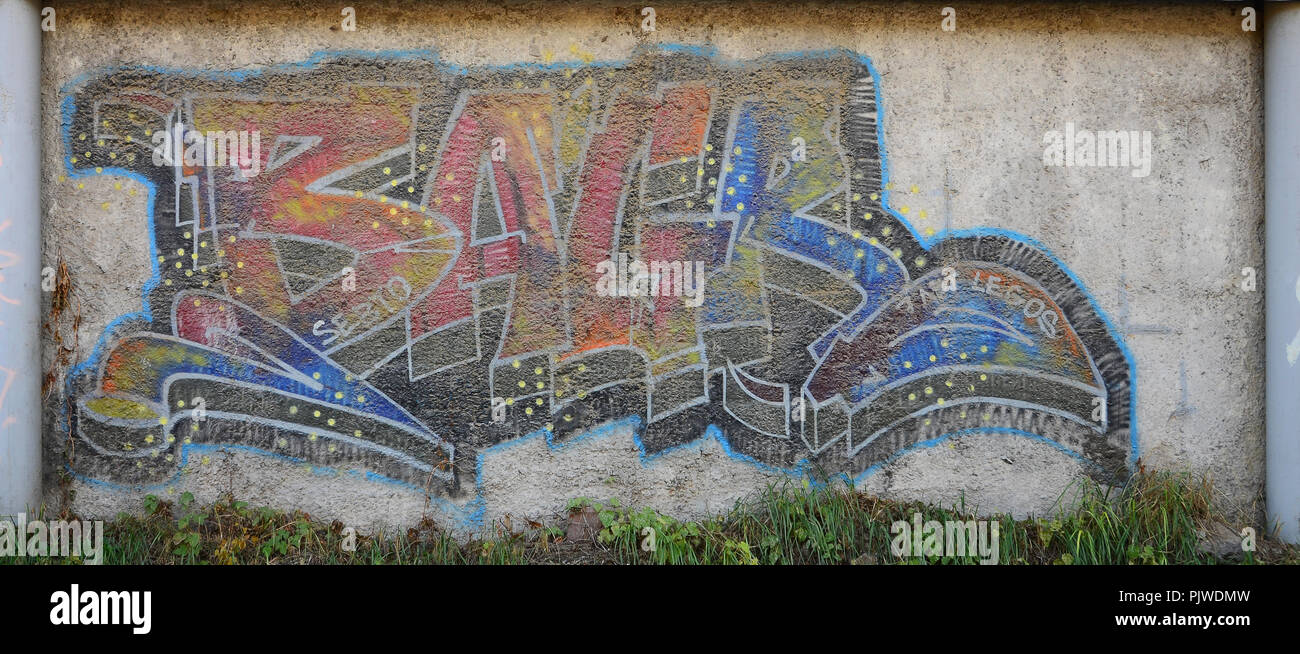 The texture of the wall with graffiti, which is depicted on it. The ...