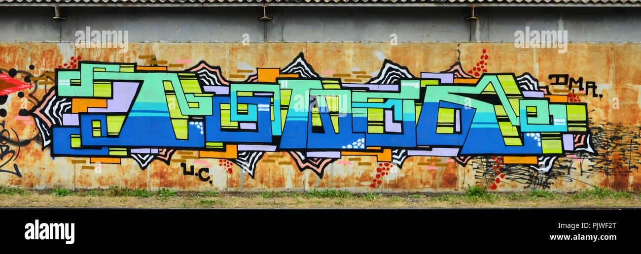 Some elements of a large and composite graffiti pattern on the wall ...