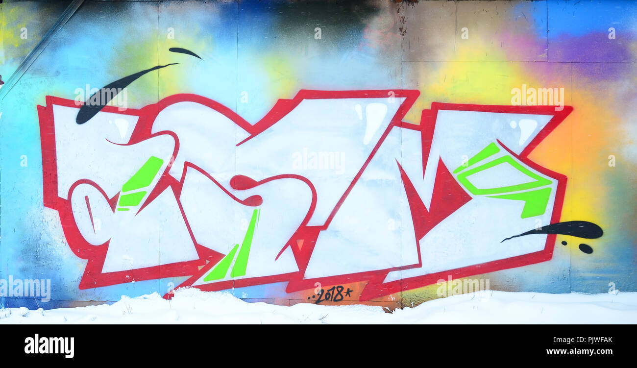 Close-up fragment of a graffiti drawing applied to the wall by aerosol ...