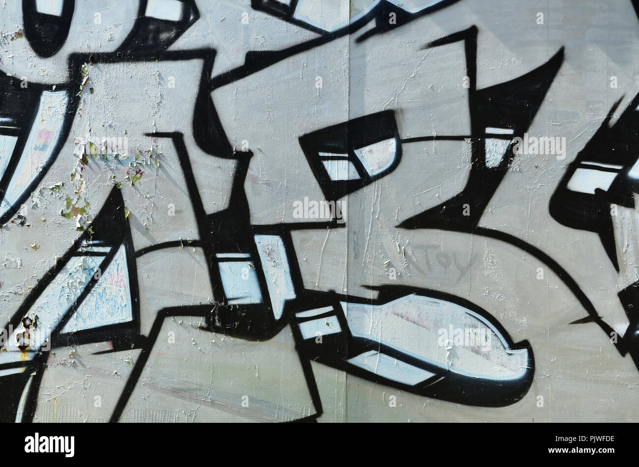 The old wall, painted in color graffiti drawing silver chrome aerosol ...