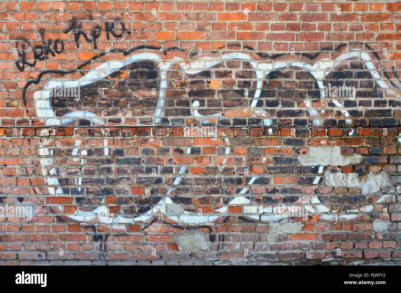 The texture of the wall with graffiti, which is depicted on it. The ...