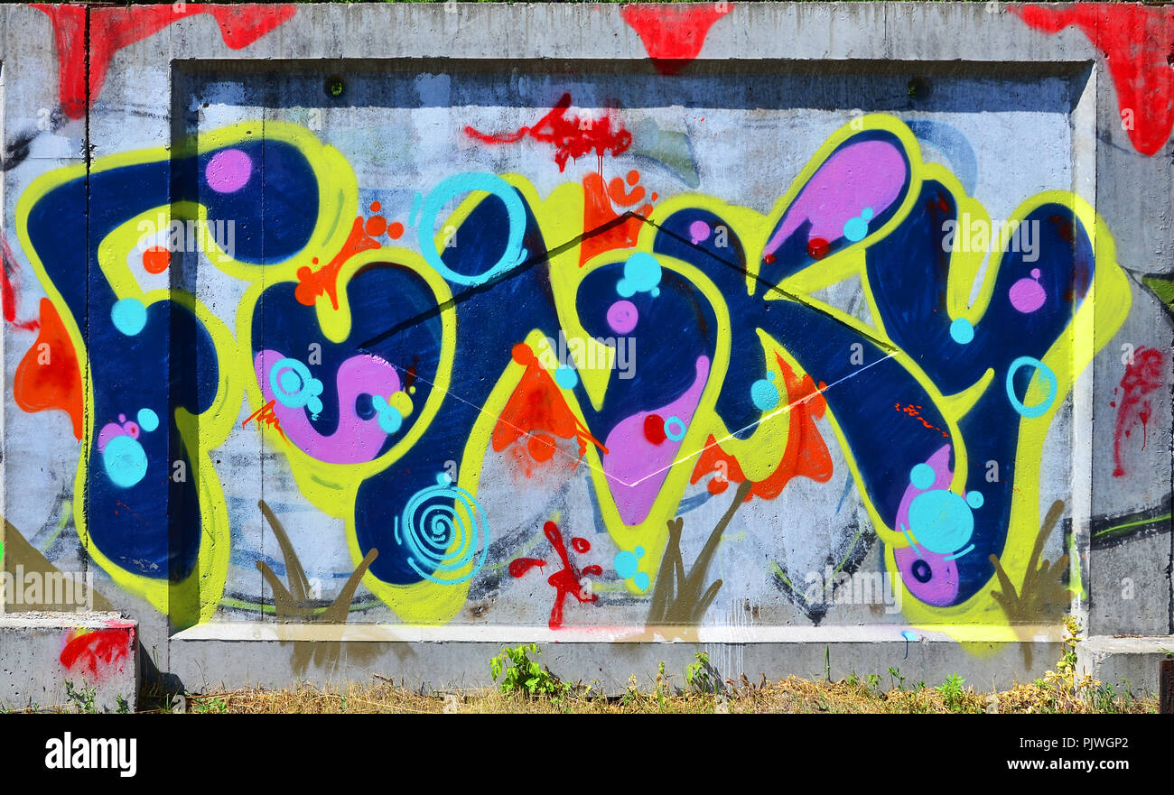The texture of the wall with graffiti, which is depicted on it. The ...