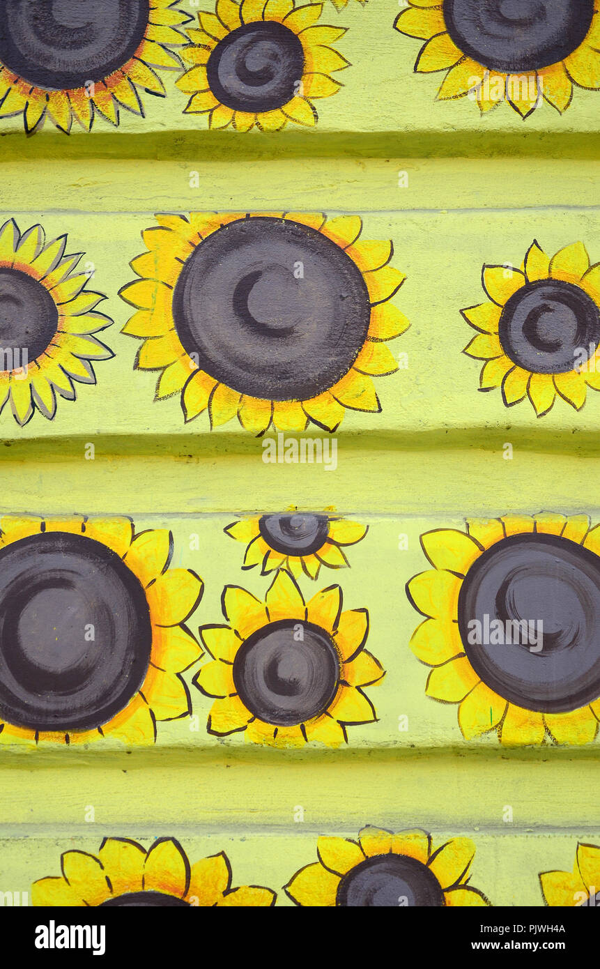 Background texture of wall with graffiti paintings. Yellow sunflowers ...
