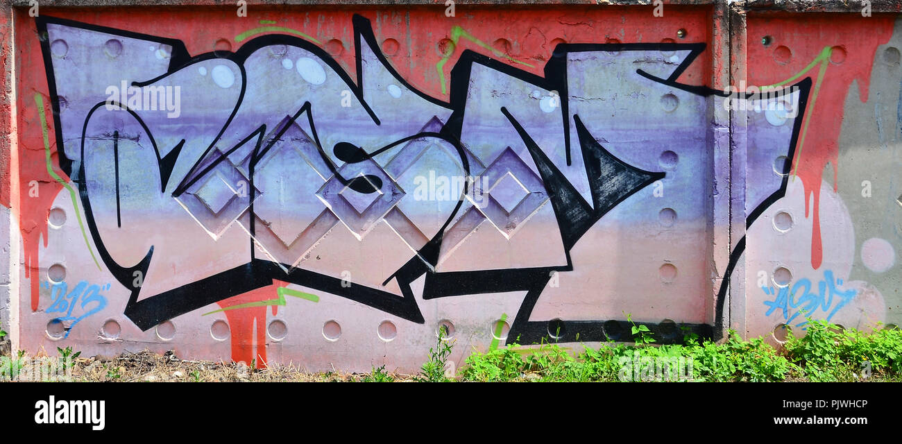 The texture of the wall with graffiti, which is depicted on it. The ...