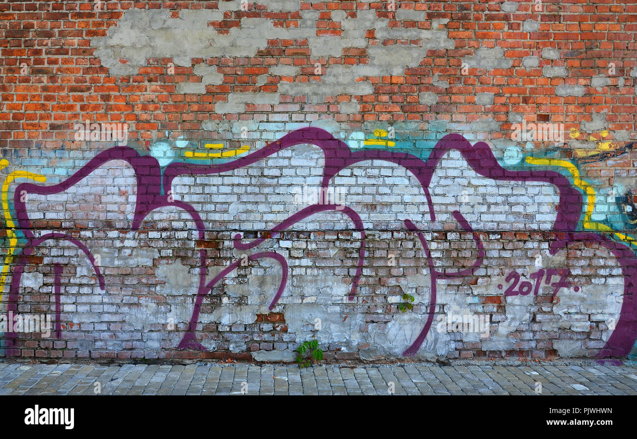 The texture of the wall with graffiti, which is depicted on it. The ...