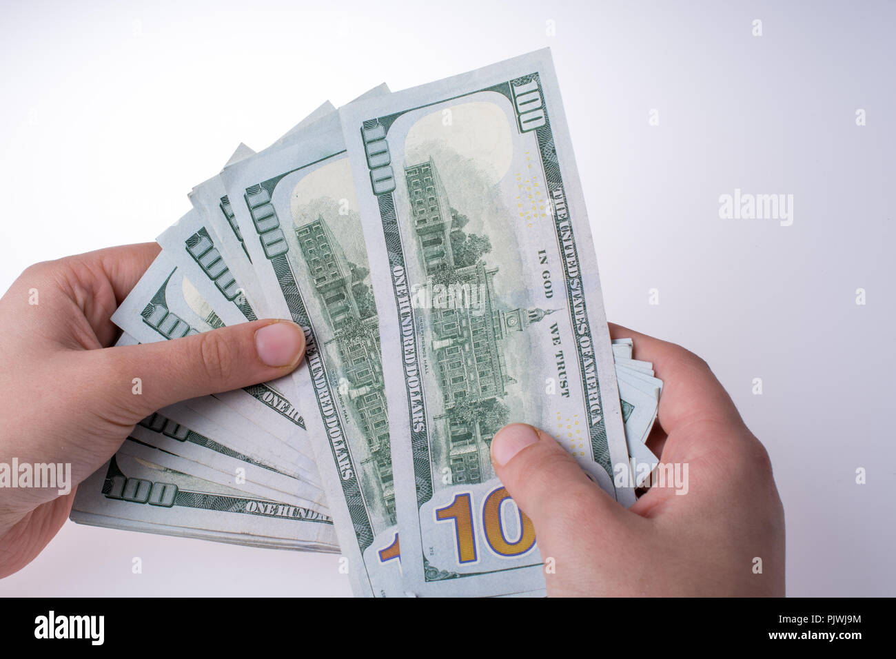 Human hand holding American dollar bill as money isolated on white ...