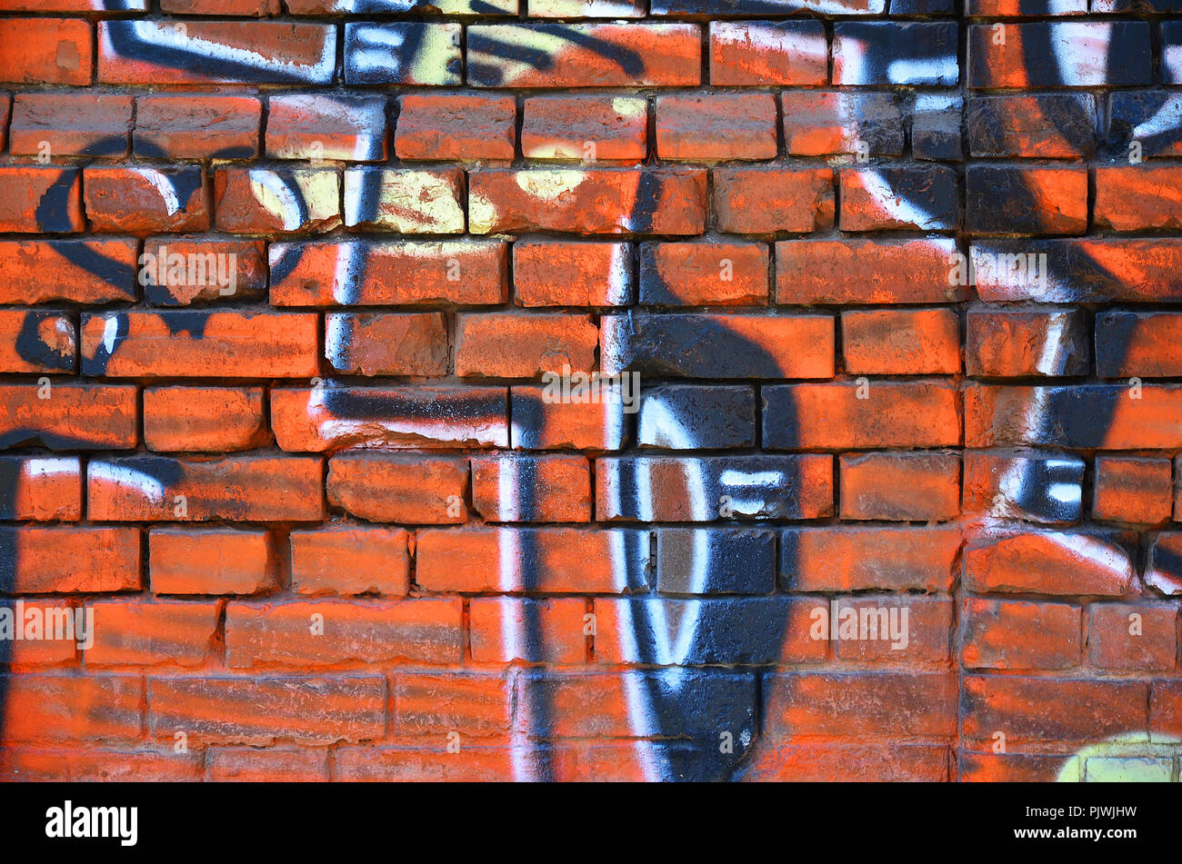 Fragment of an old colored graffiti drawing on the wall. Background ...