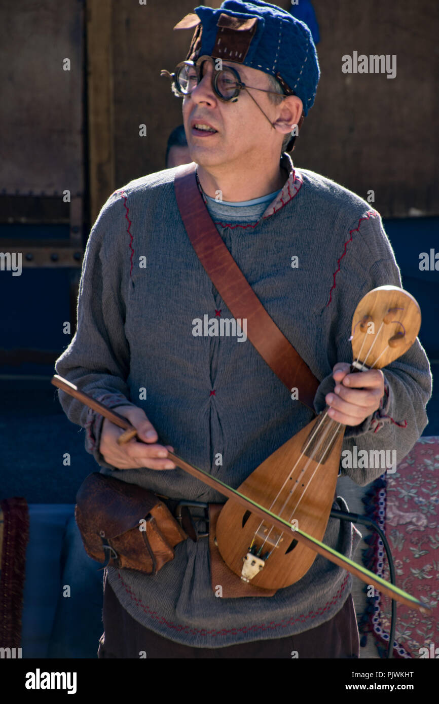 Penedono , Portugal / July 1, 2017 - Man plays Rebec string instrument ...