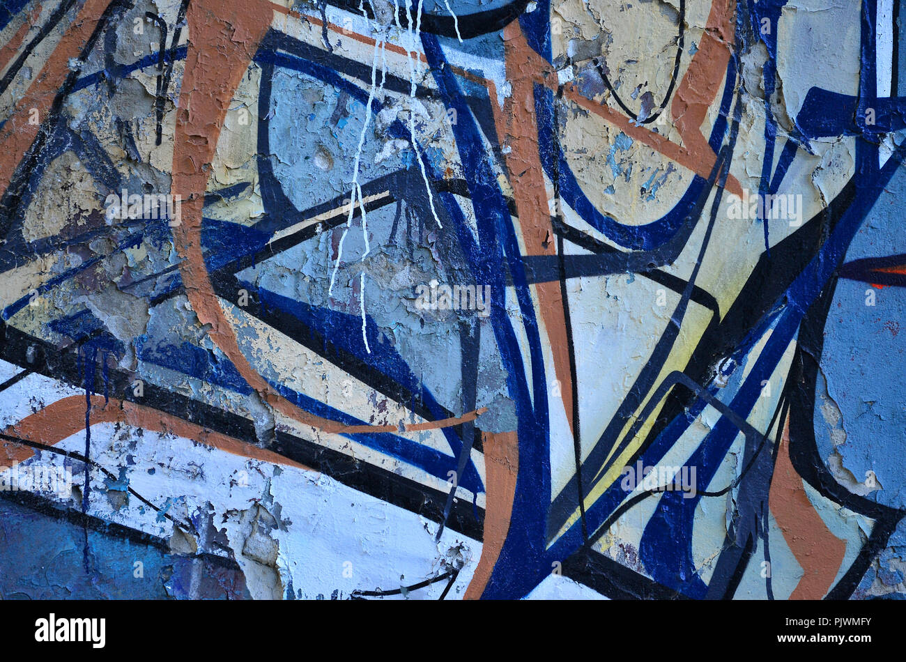 Detailed image of very old and aged color graffiti drawing on the wall ...