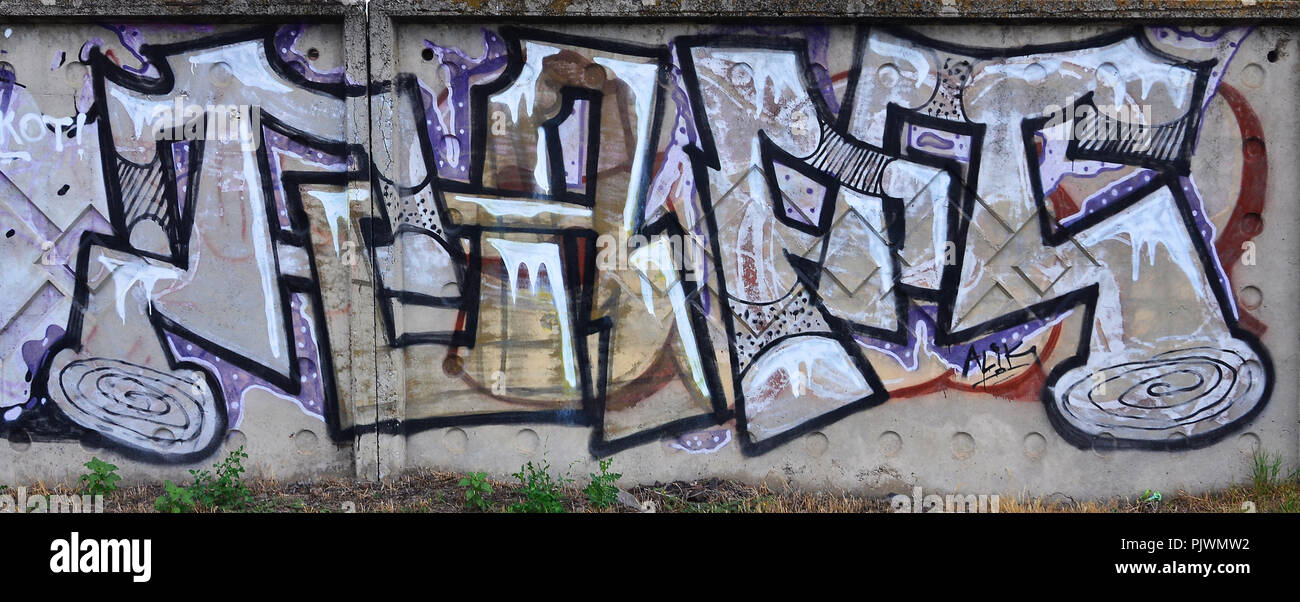 The texture of the wall with graffiti, which is depicted on it. The ...