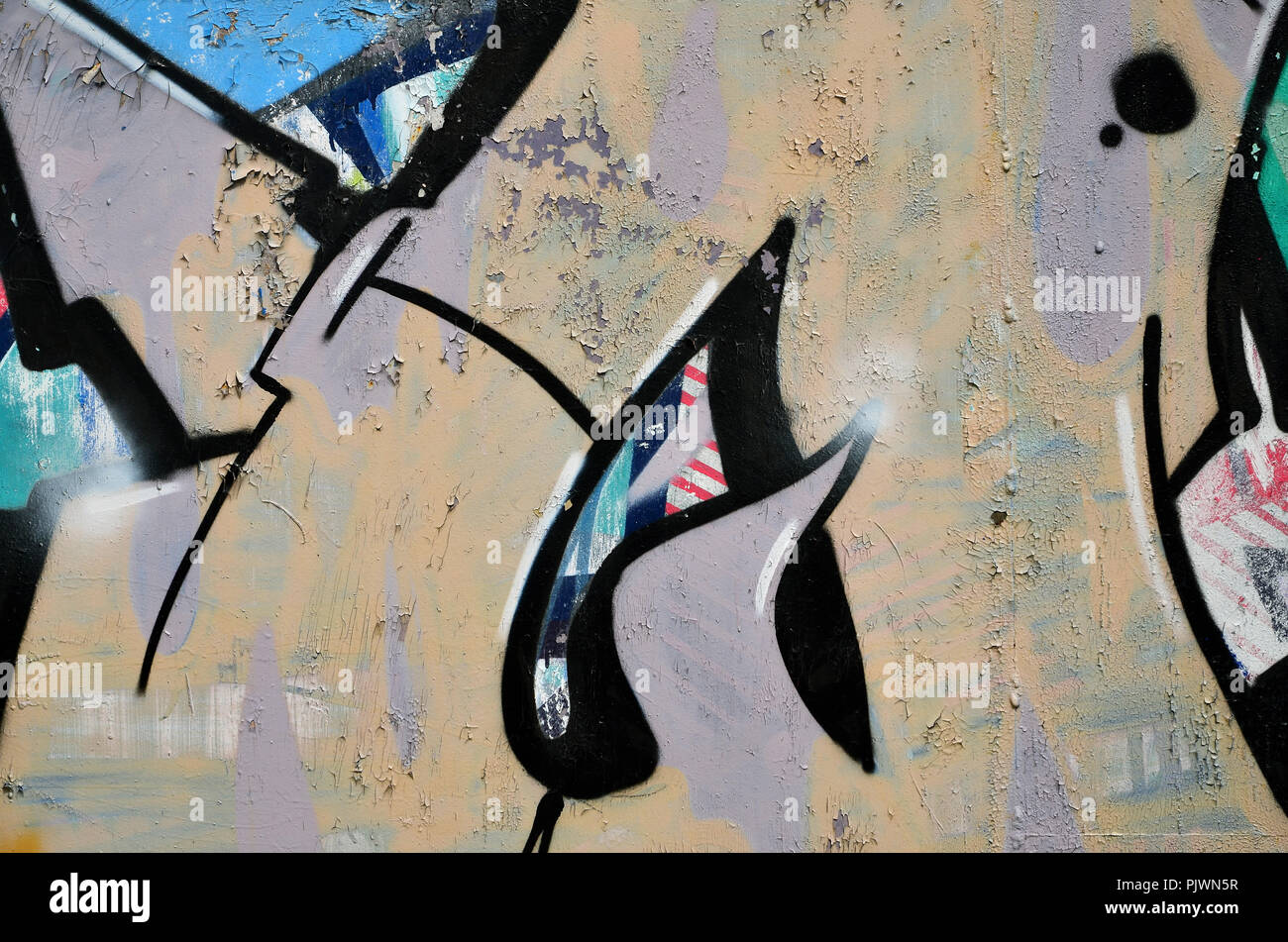 Background image of the wall decorated with colorful abstract graffiti ...