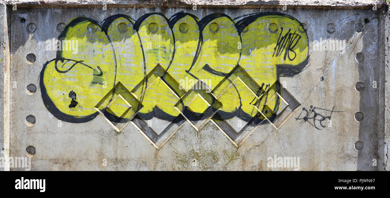 The texture of the wall with graffiti, which is depicted on it. The ...