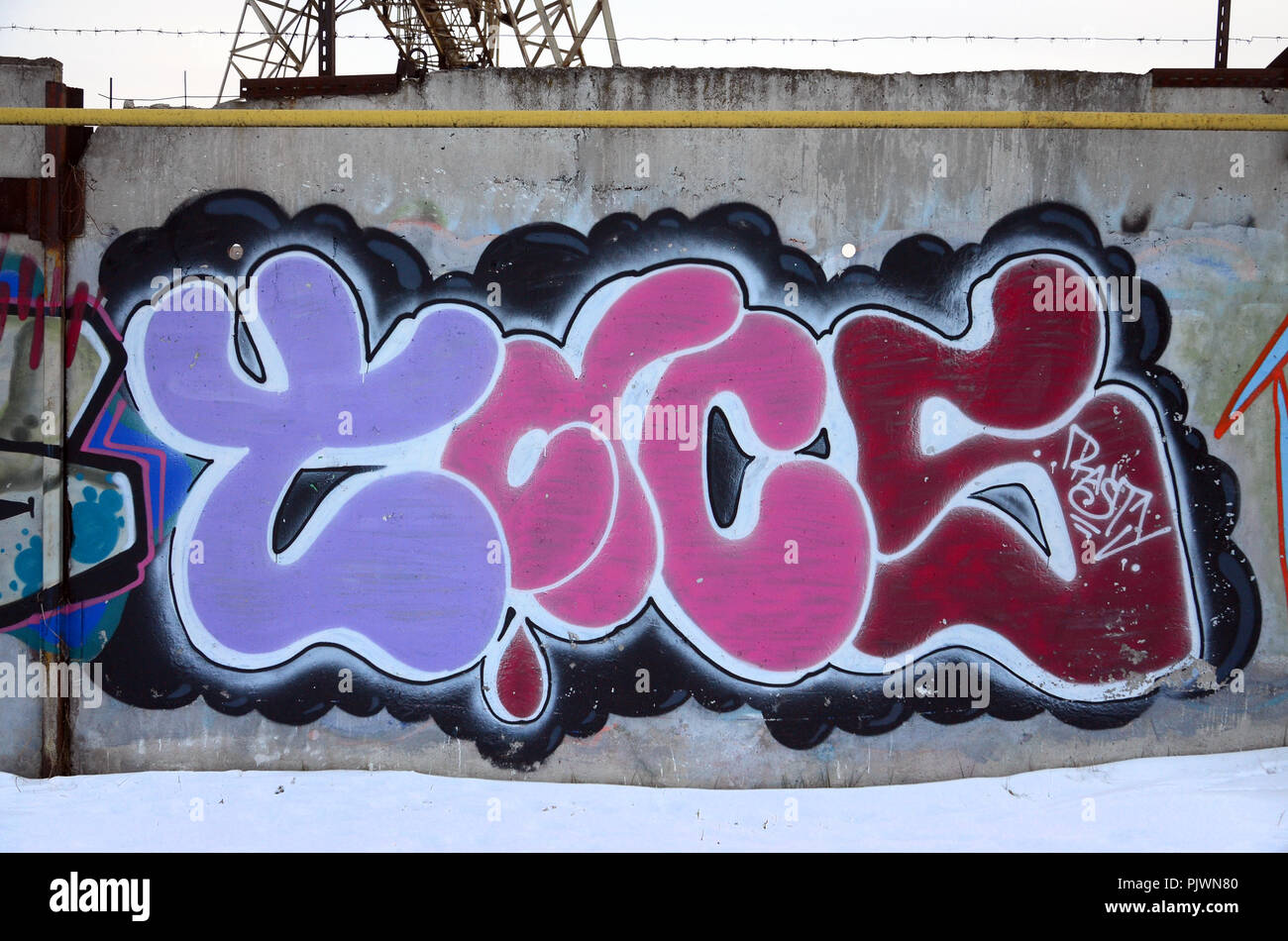 The old wall, painted in color graffiti drawing red aerosol paints ...