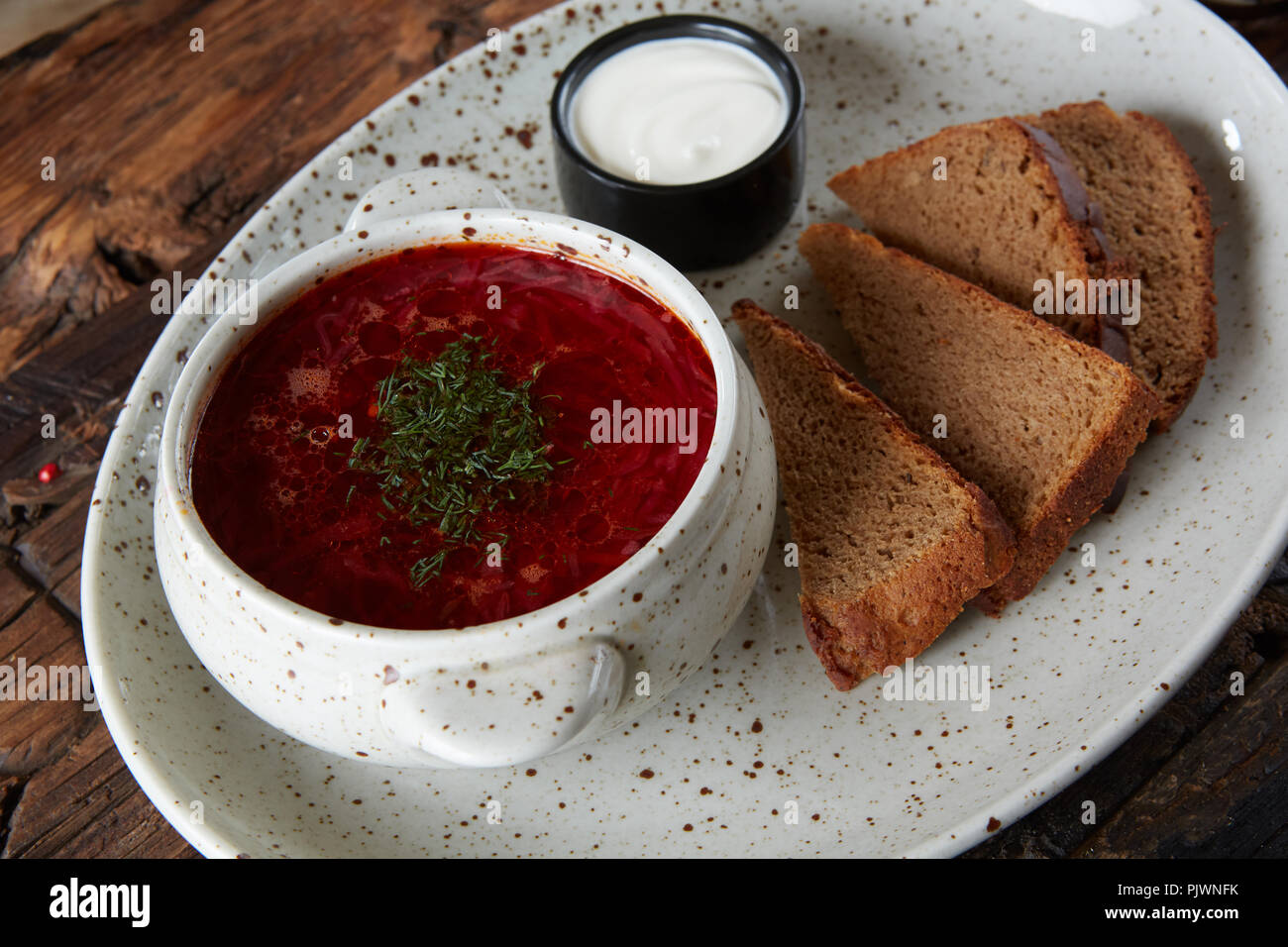 Traditional Ukrainian Russian borscht with white beans on the bowl ...