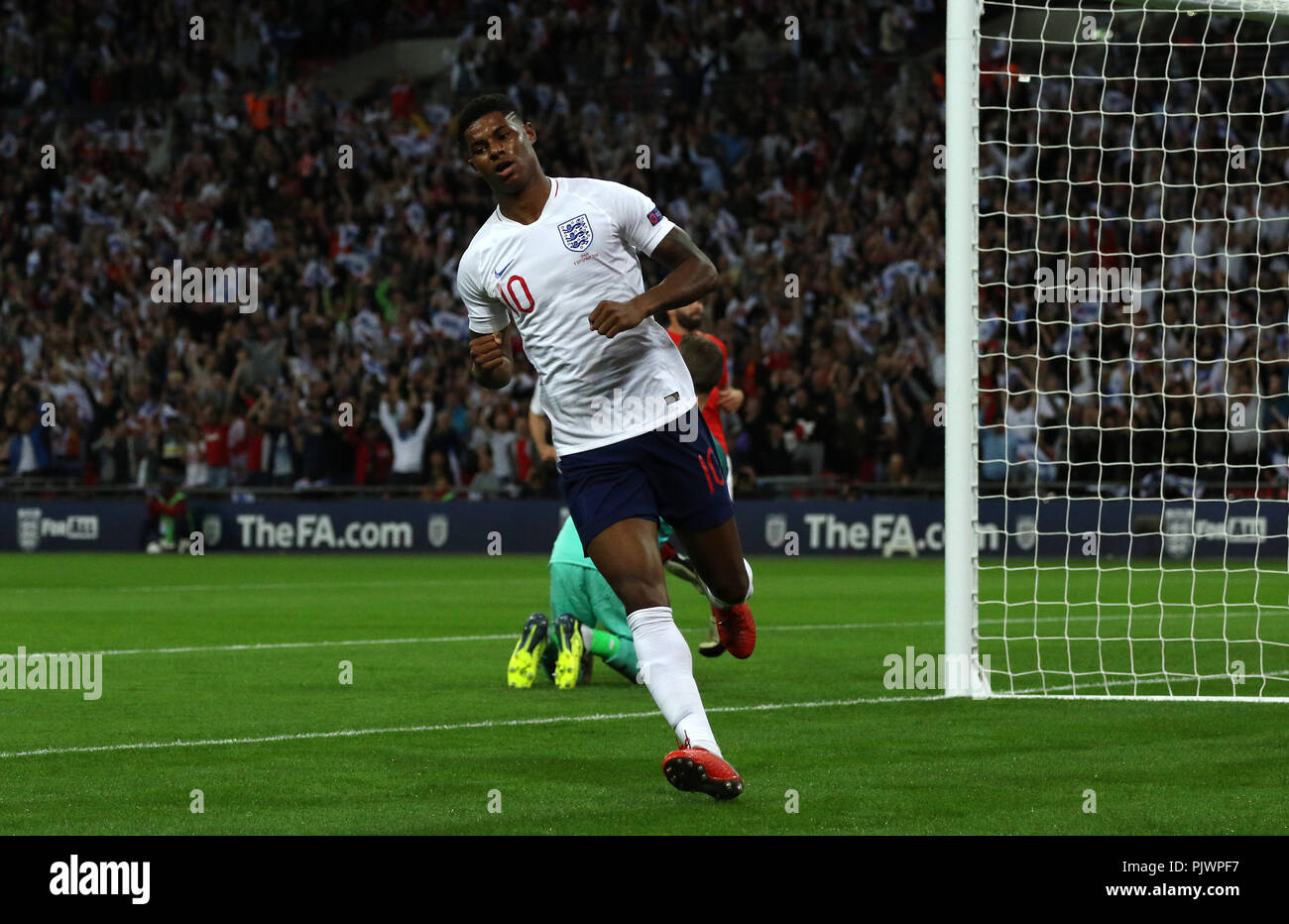 London, UK. 8th September 2018. Marcus Rashford (E) celebrates scoring ...