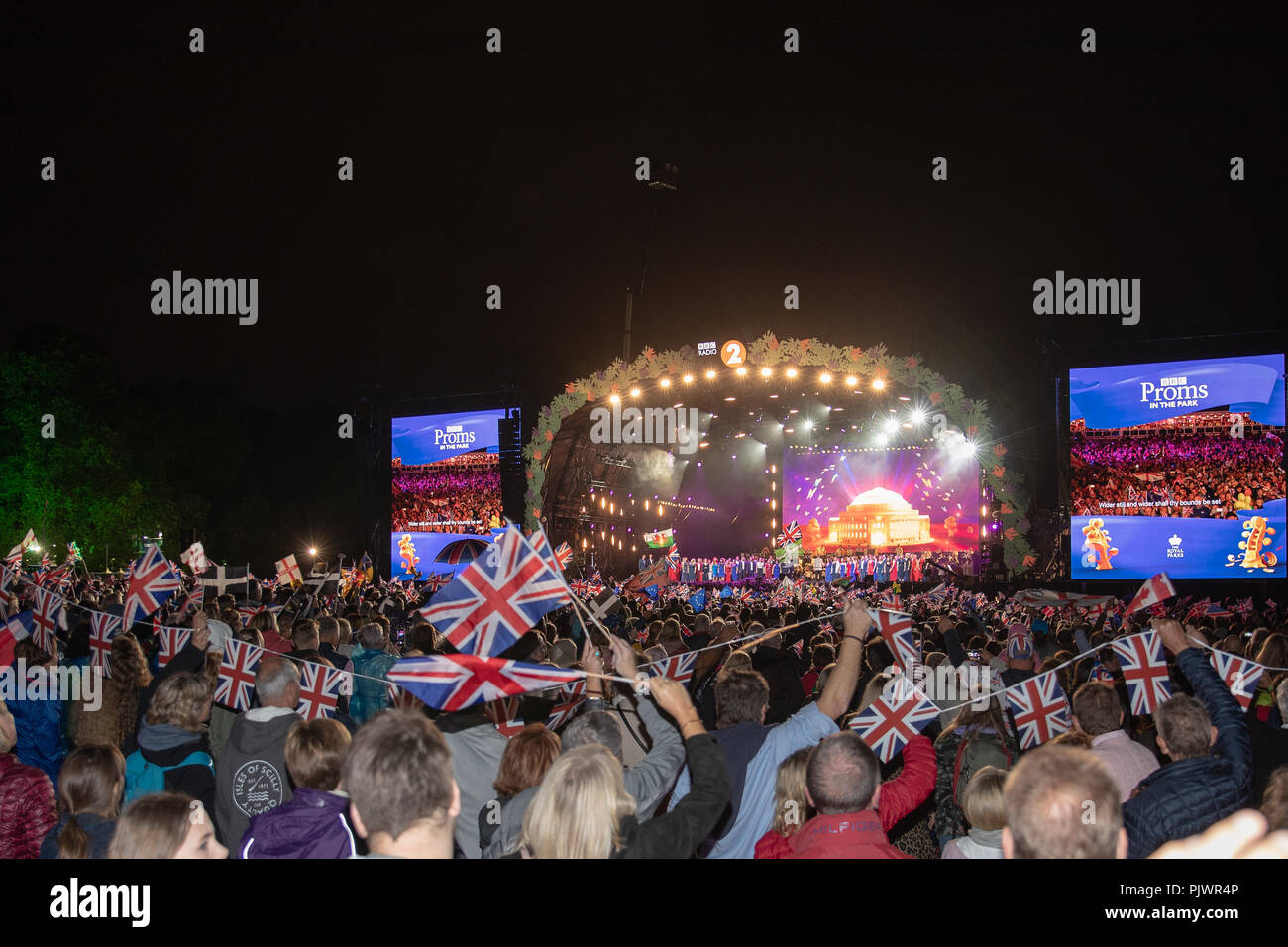London, UK. 8th Sep, 2018. A celebratory crowd waves Union Jack flags ...