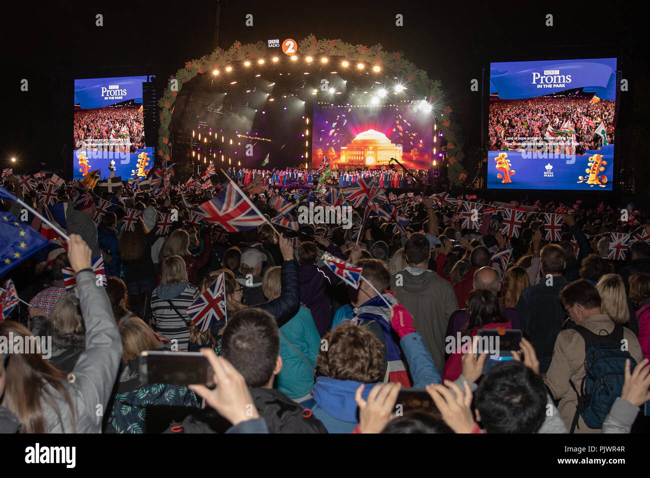 London, UK. 8th Sep, 2018. A celebratory crowd waves Union Jack flags ...