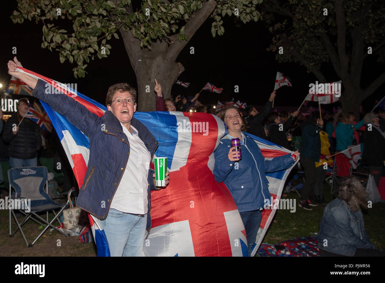 London, UK. 8th Sep, 2018. A celebratory crowd waves Union Jack flags ...