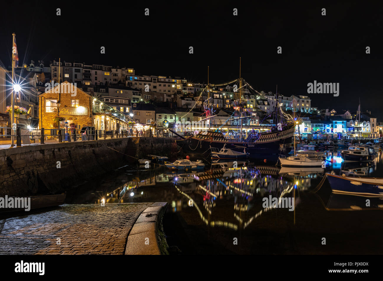 Brixham, UK. 8th September 2018. Brixham Harbour at night with boats ...