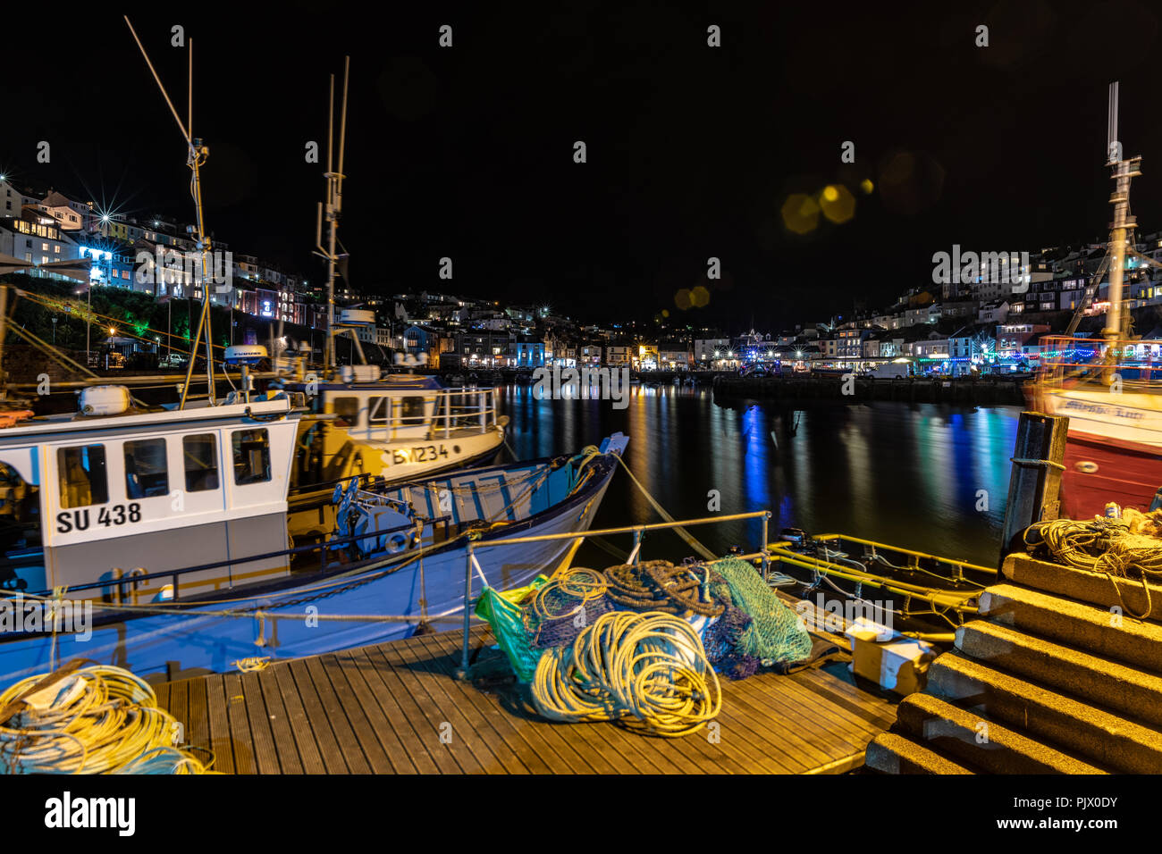 Brixham, UK. 8th September 2018. Brixham Harbour at night with boats ...