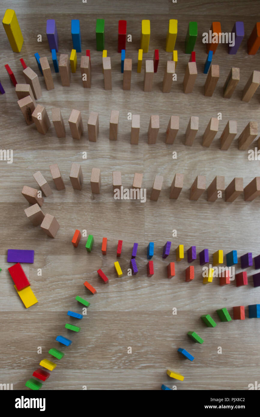 Colorful Domino Blocks in a line on a white background Stock Photo - Alamy