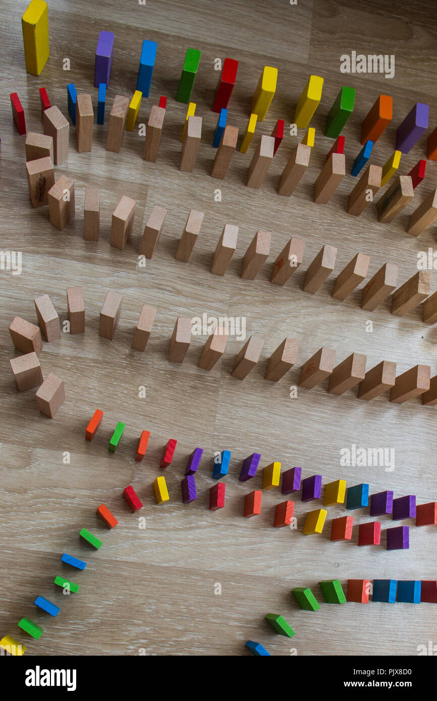 Colorful Domino Blocks in a line on a white background Stock Photo - Alamy
