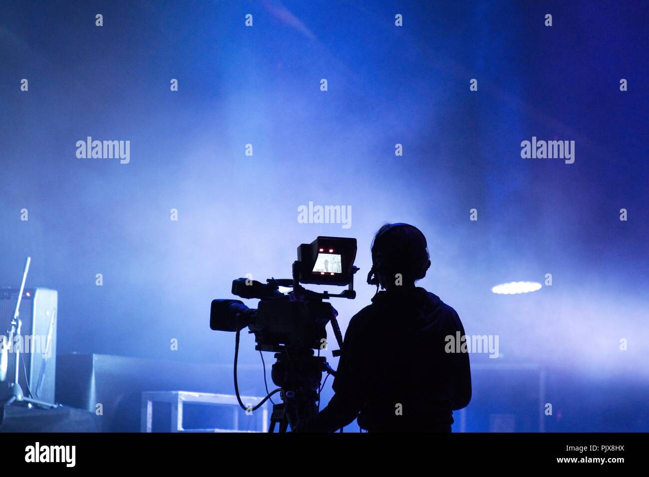 Cameraman in a concert Stock Photo - Alamy