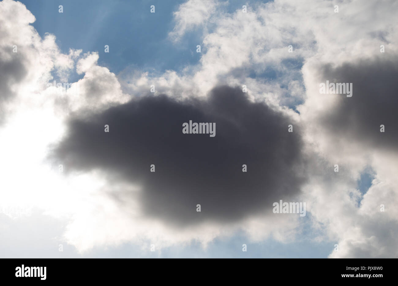 Grey color clouds partly cover the sky in the daytime Stock Photo - Alamy