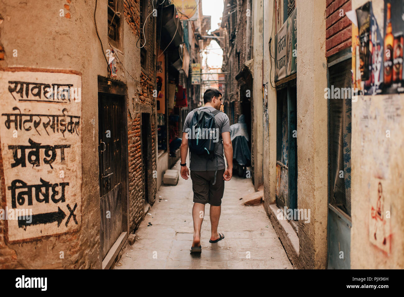 Man exploring alleyway hi-res stock photography and images - Alamy