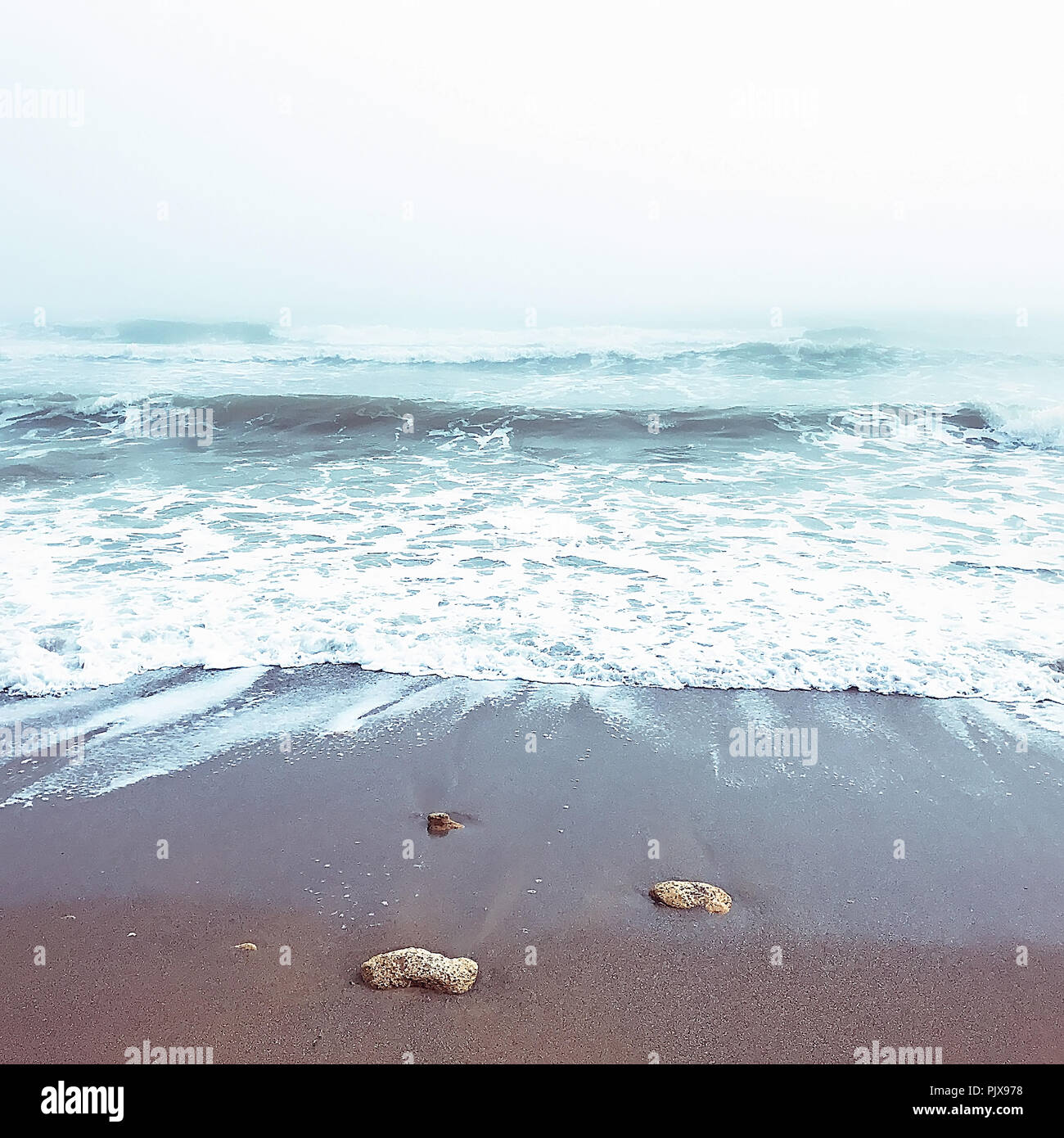 Waves receding on beach hi-res stock photography and images - Alamy