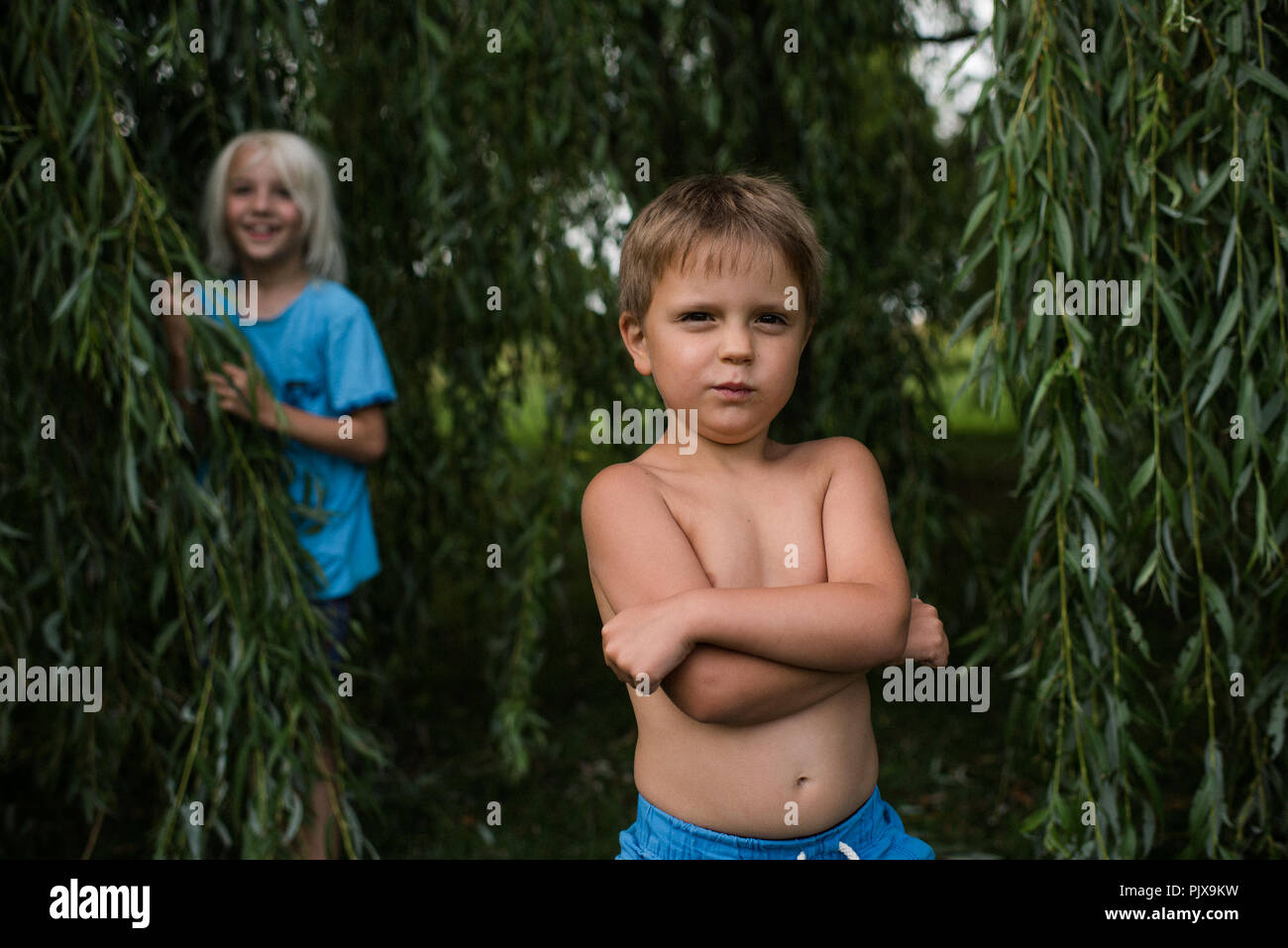 Two children playing tree hi-res stock photography and images - Alamy