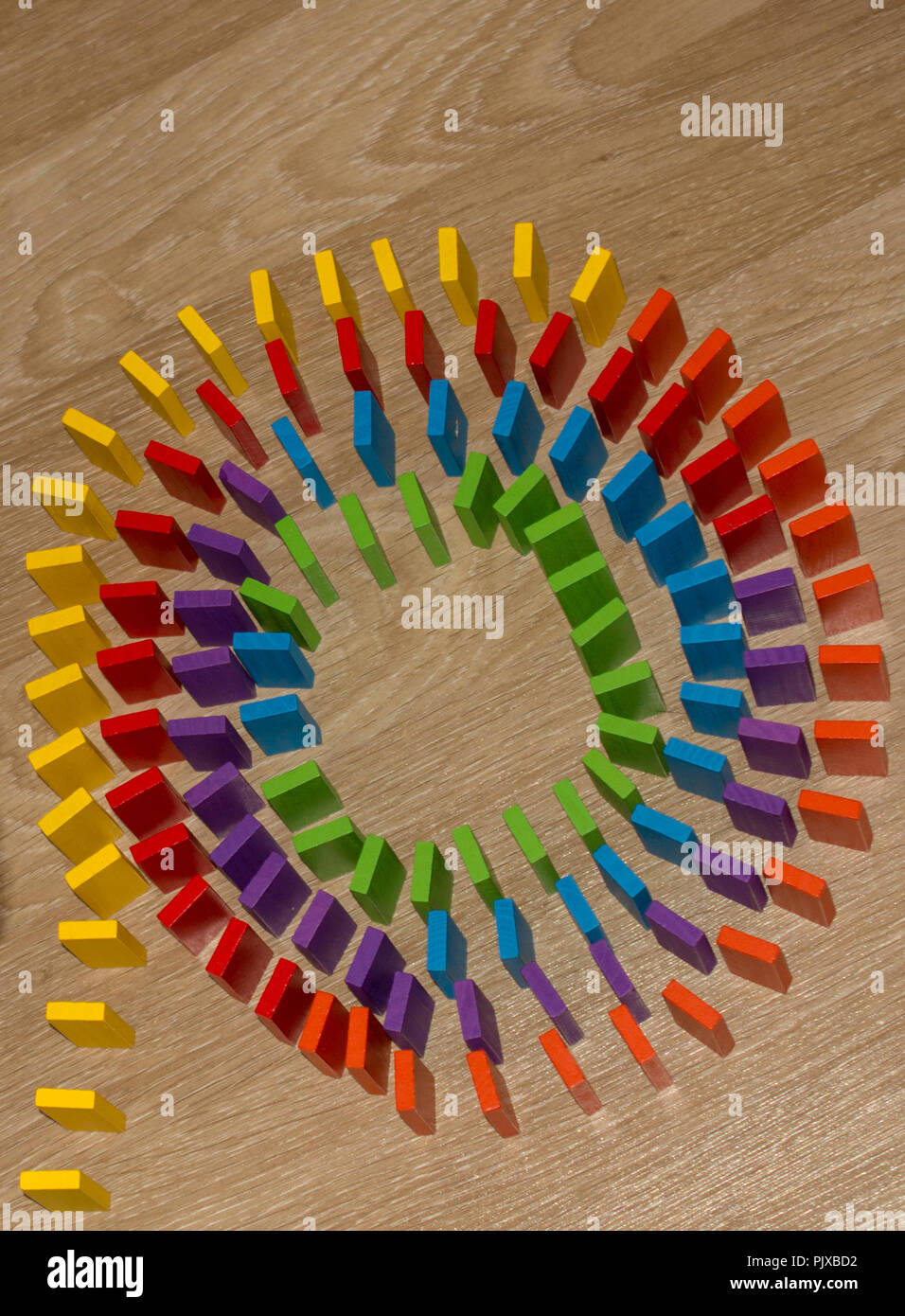 Colorful Domino Blocks in a line on a white background Stock Photo - Alamy