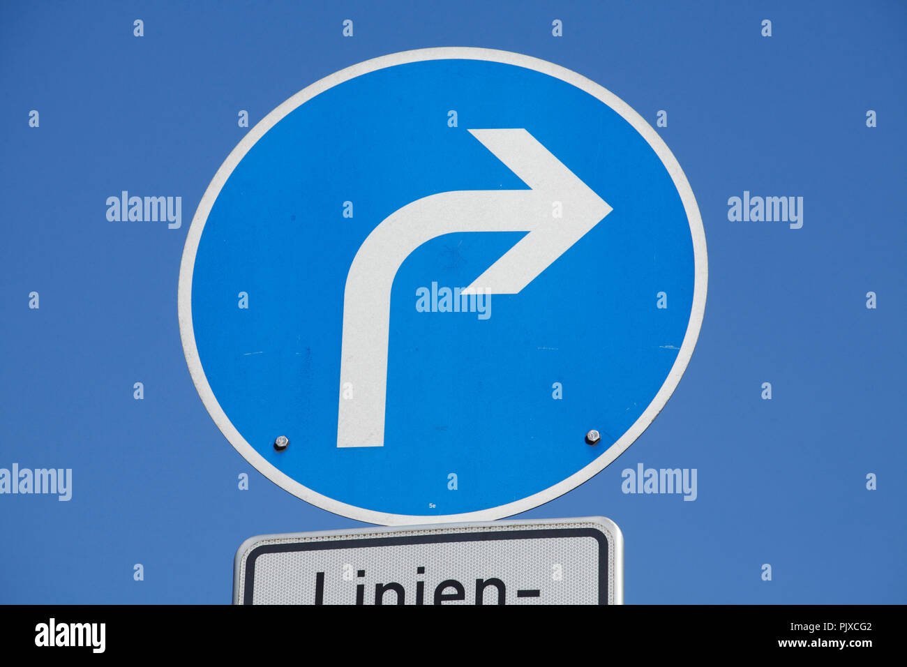 Road sign Prescribed direction of travel on the right Stock Photo - Alamy