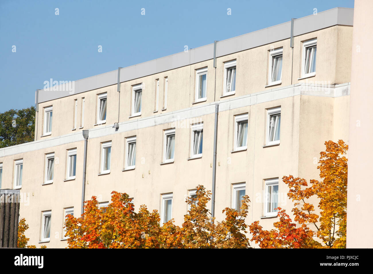 Residential building, apartment building in autumn Stock Photo - Alamy