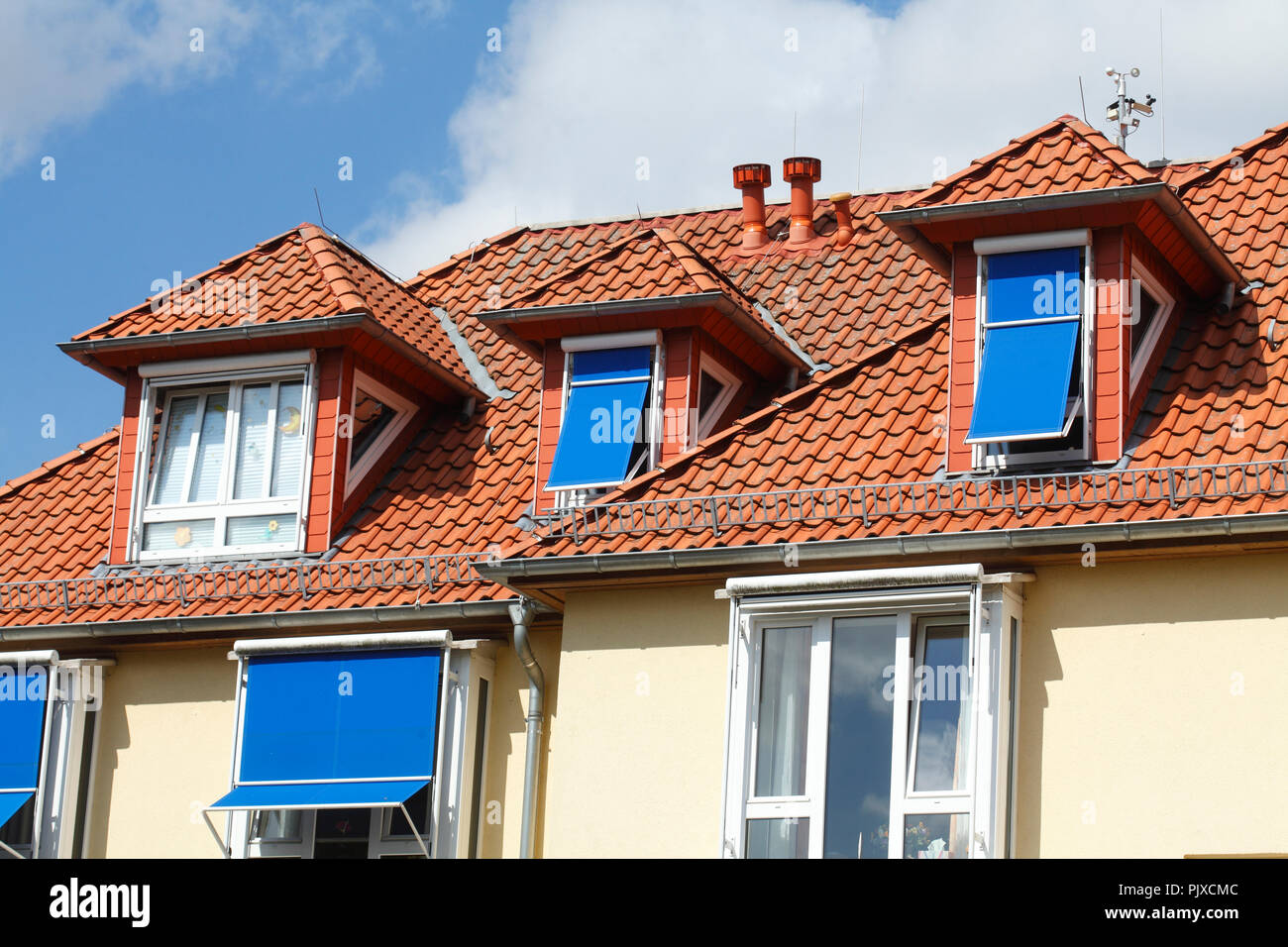 Yellow modern residential building Stock Photo - Alamy
