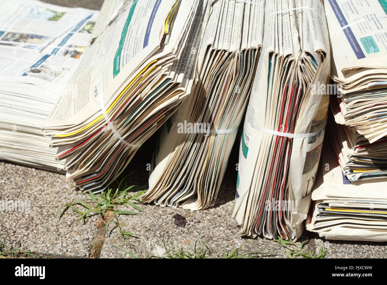 Newspaper pile of daily newspapers, background, texture Stock Photo - Alamy