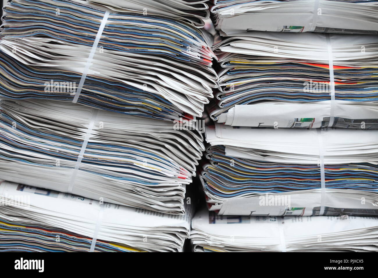 Newspaper pile of daily newspapers, background, texture Stock Photo - Alamy