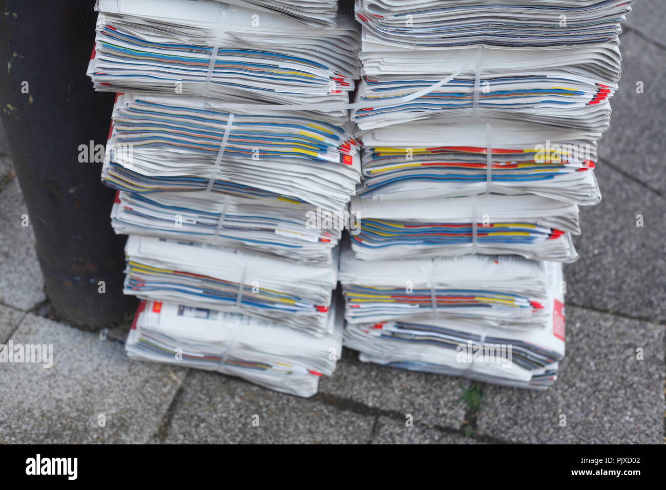 Newspaper pile of daily newspapers, background, texture Stock Photo - Alamy