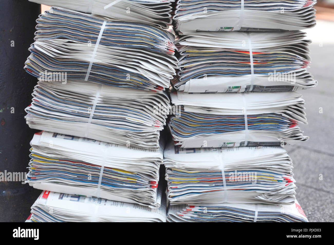 Newspaper pile of daily newspapers, background, texture Stock Photo - Alamy