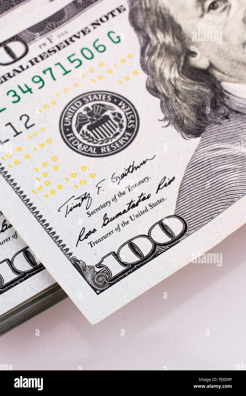 American 100 dollar banknotes made of paper placed on white background ...