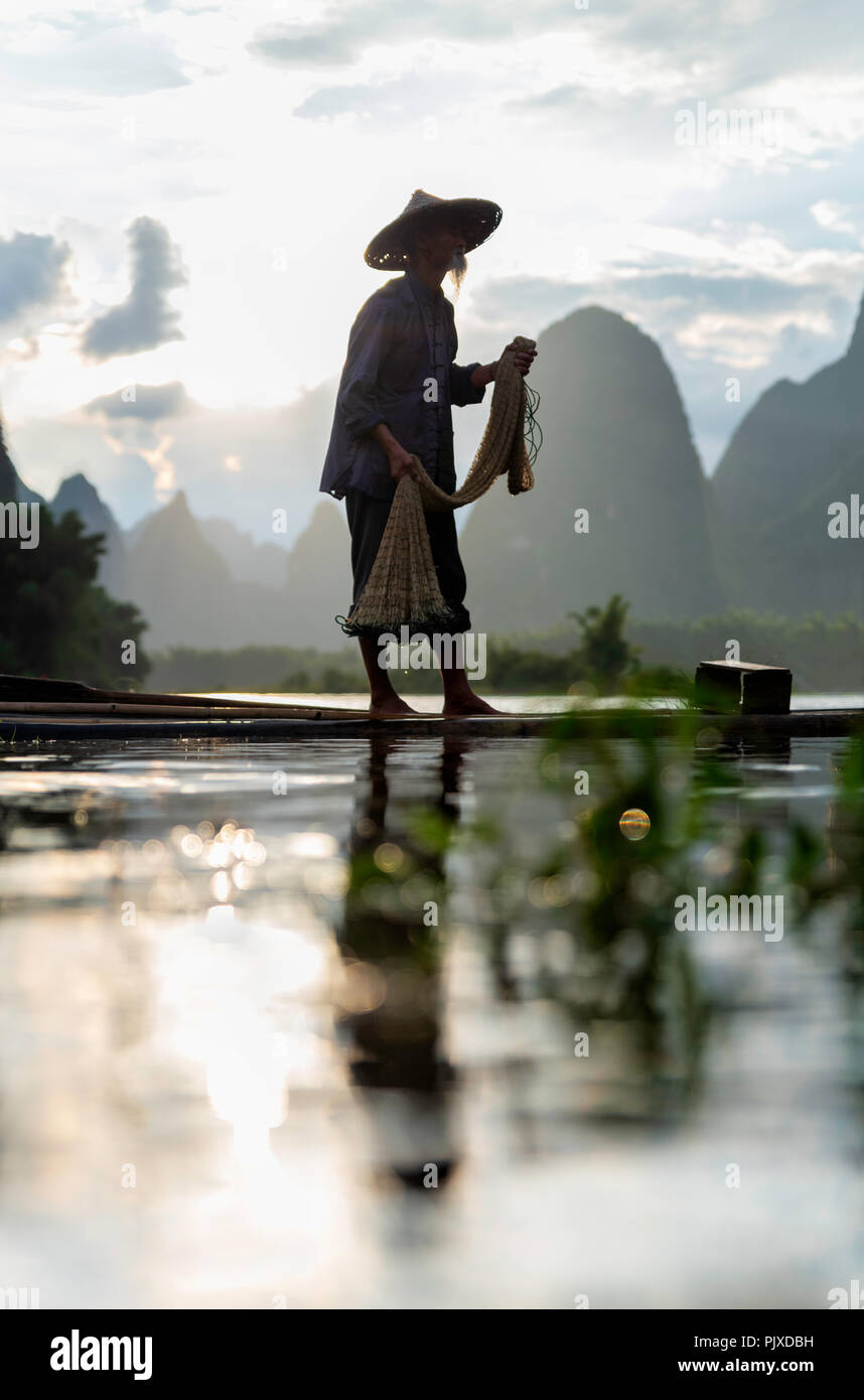 Fisherman with cormorant bird hi-res stock photography and images - Alamy