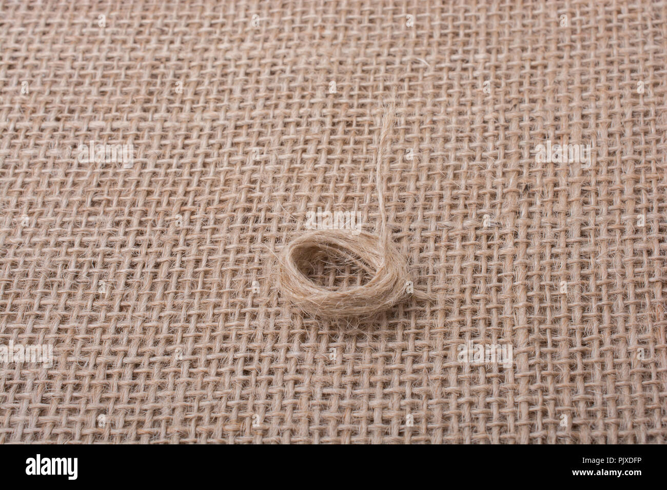 Roll of brown color linen string paper background Stock Photo - Alamy
