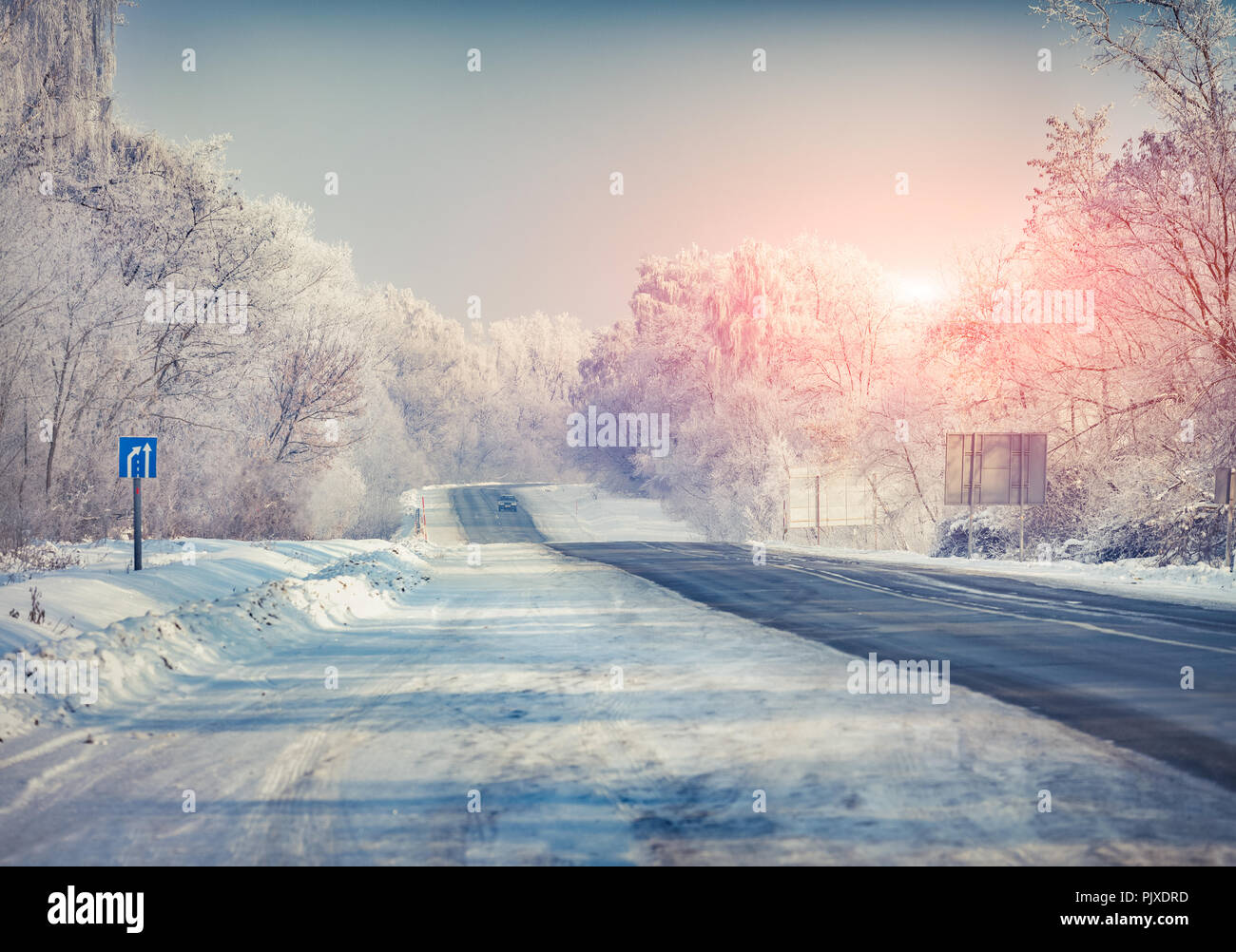 Beautiful winter landscape with a highway. Retro style Stock Photo - Alamy