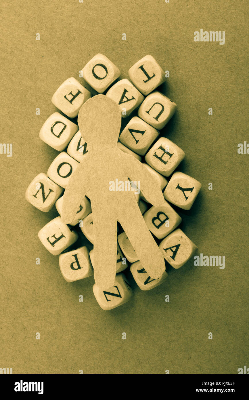 Paper man and letter cubes of made of wood Stock Photo - Alamy