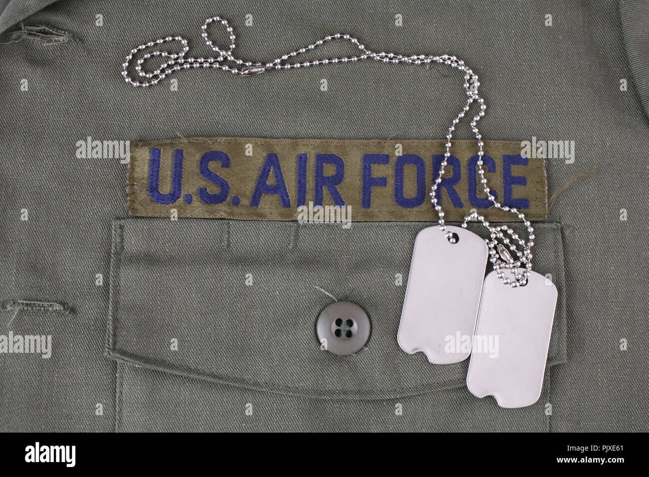 U.S. AIR FORCE Branch Tape with dog tags on olive green uniform ...